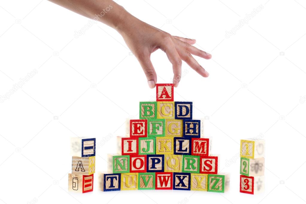 The hand holds a cube with letters Stock Photo by ©Qpicimages 75990233