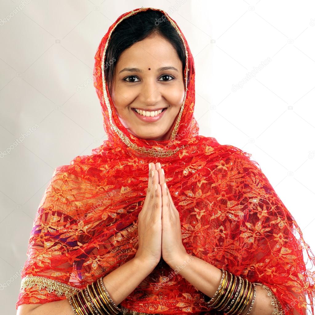 Young Indian woman with hands in prayer position — Stock Photo ...