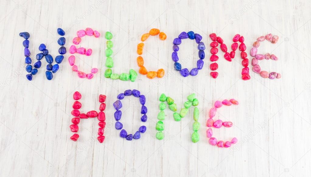 Welcome home note written with small rocks — Stock Photo ...