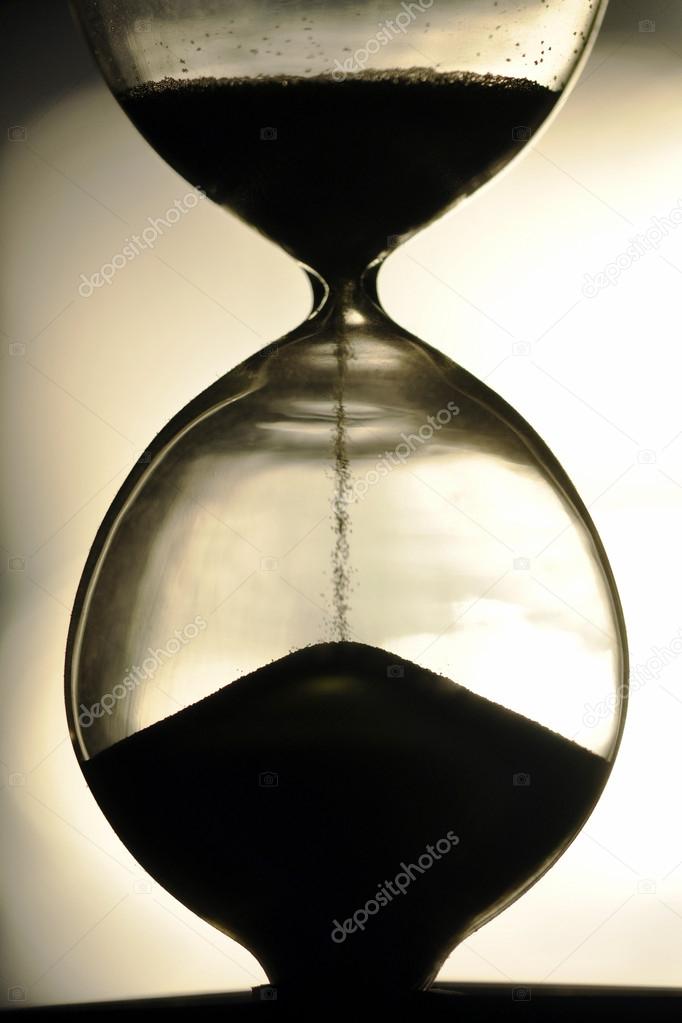 Close up hourglass counting down time with moving sand view vin — Stock ...