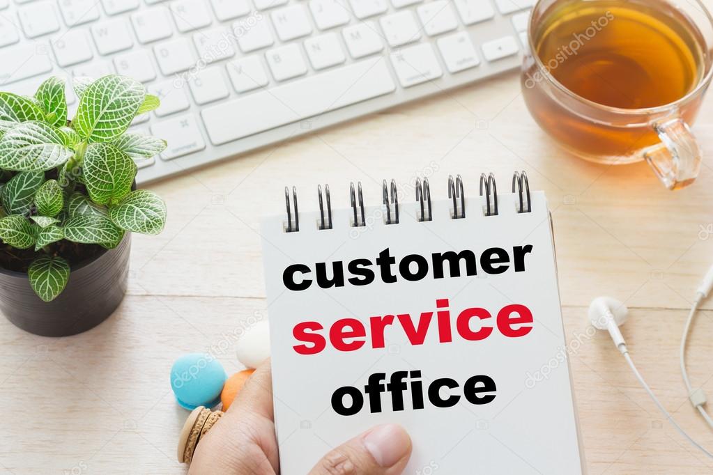 Man holding customer service office message on book and keyboard with a ...