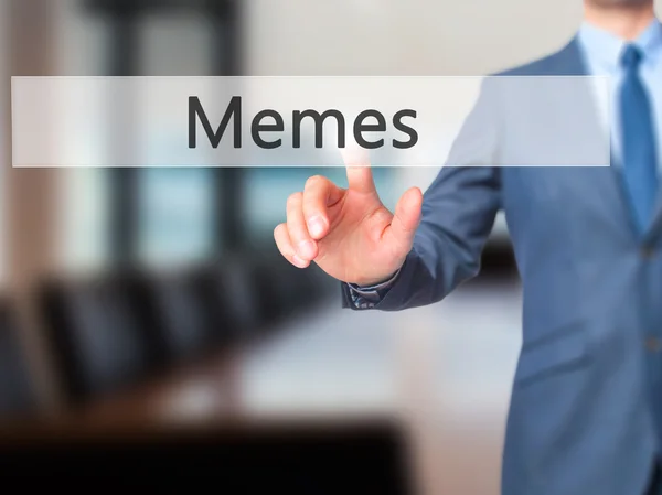 Memes - Hand pressing a button on blurred background concept on Stock ...