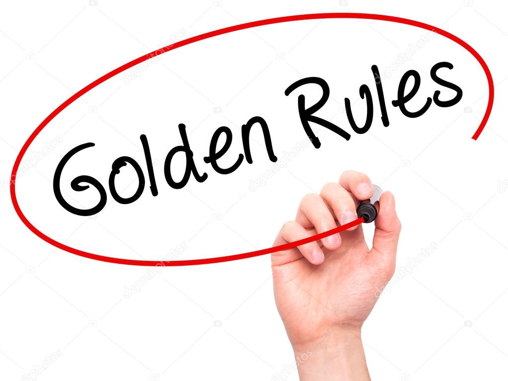 Man Hand writing Golden Rules with black marker on visual screen ...