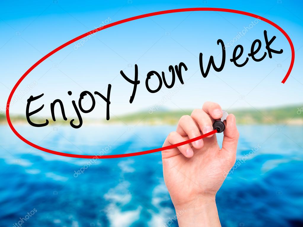 Man Hand writing Enjoy Your Week with black marker on visual scr ...