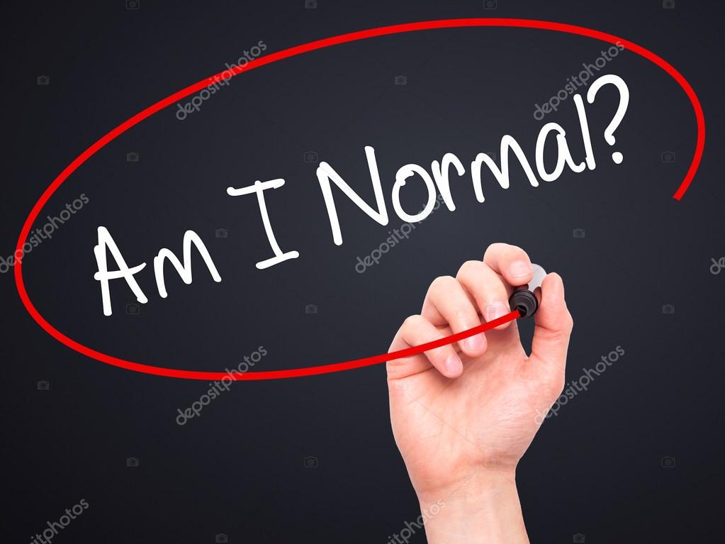 Man Hand writing Am I Normal? with black marker on visual screen ...