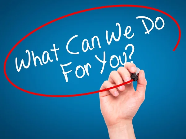 Man Hand writing What Can We Do For You? with black marker on vi ...