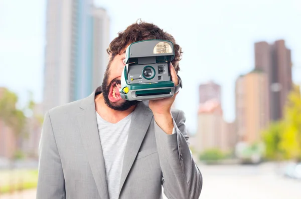 Young crazy man with a camera - Stock Image - Everypixel