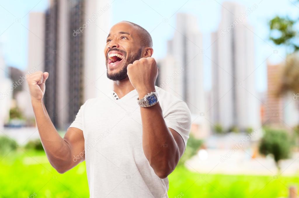 Young cool black man celebratin sign Stock Photo by ©kues 65700157