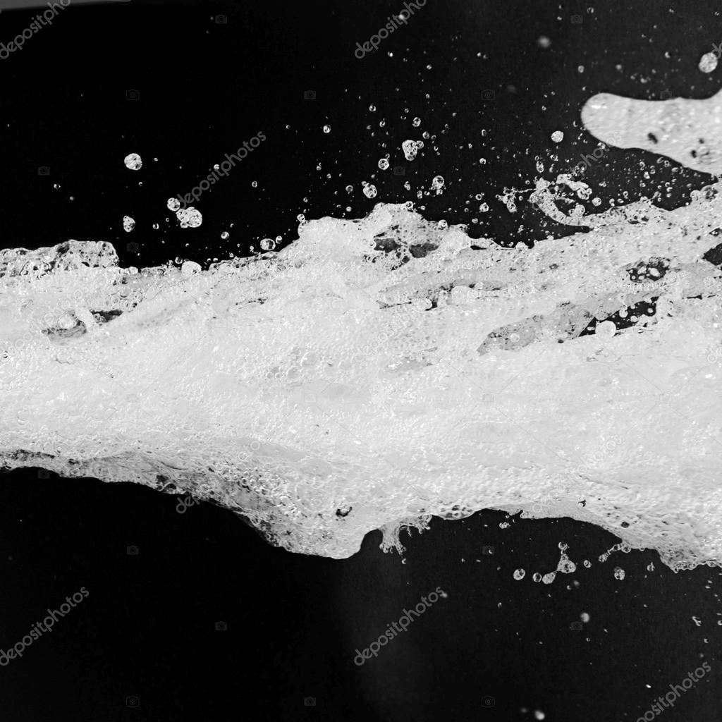 White water splash over black background Stock Photo by ©kues 67569567