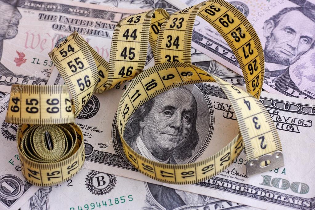 Dollar banknotes and yellow tape measure — Stock Photo © Professor25 ...