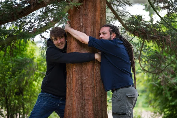 People hugging trees to support nature , environment concept - Stock ...