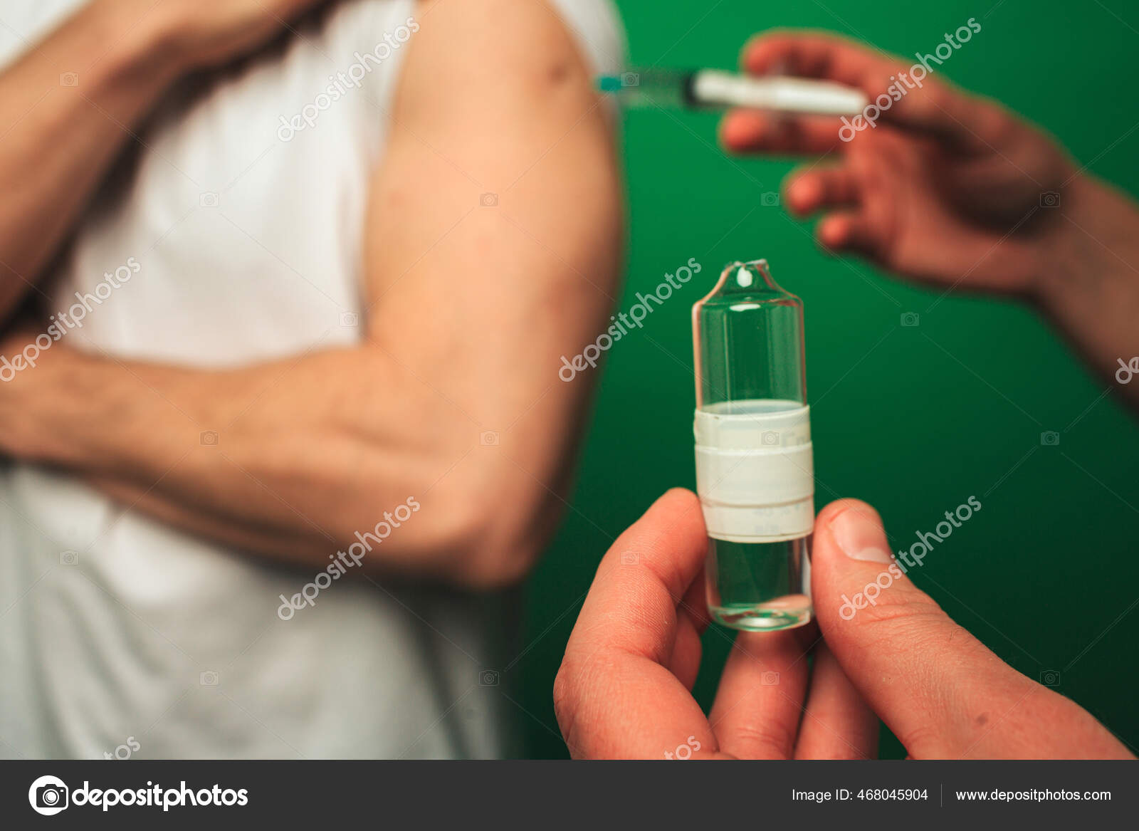 Close up man gets injections, isolated on green background Stock Photo ...