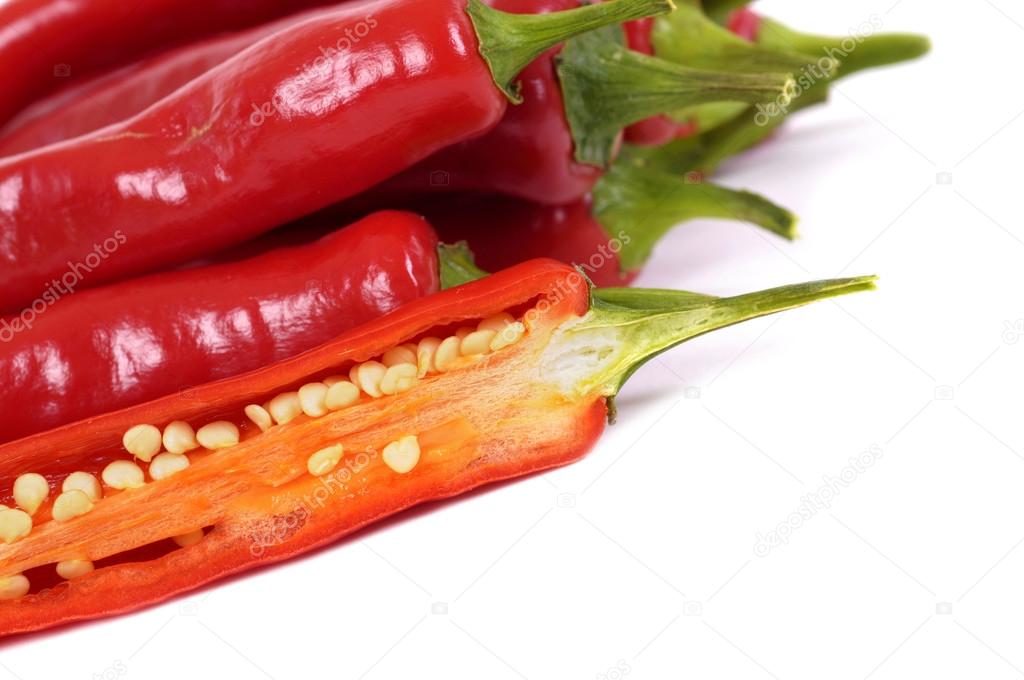 Red chili peppers inside showing seeds isolated on white background ...