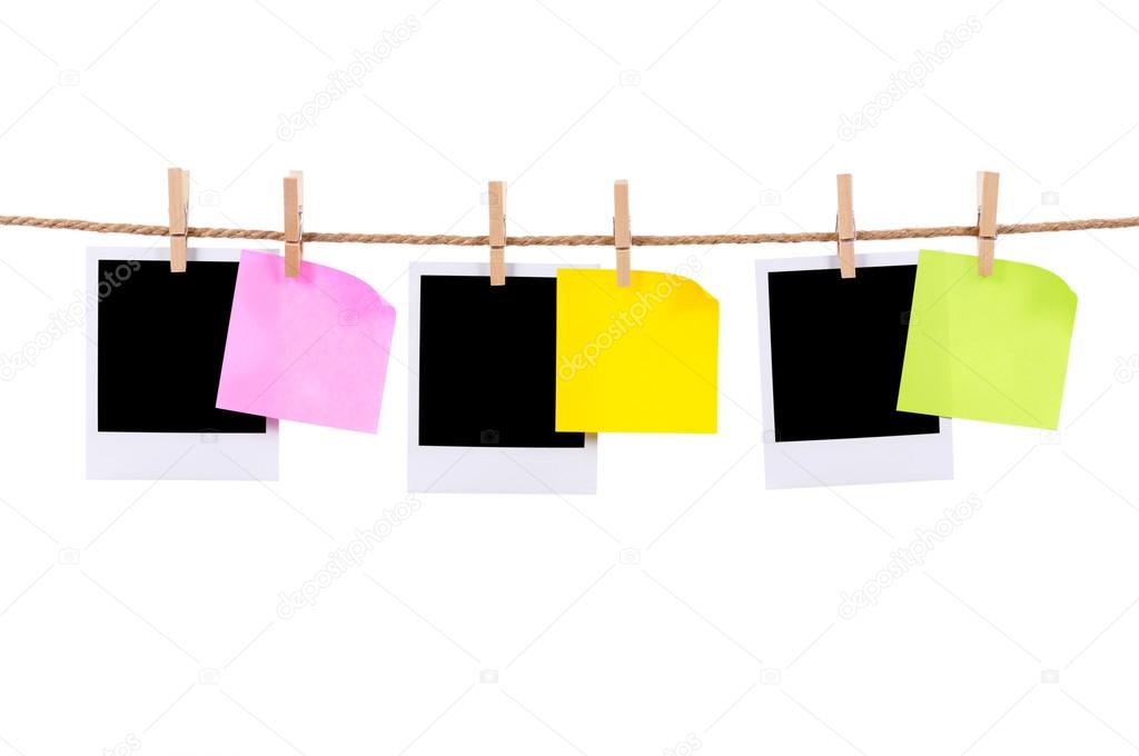 Blank photo prints and sticky notes on a rope — Stock Photo © david ...