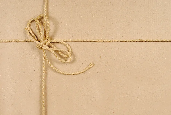 Package in brown paper tied with string Stock Photo by ©elenathewise ...