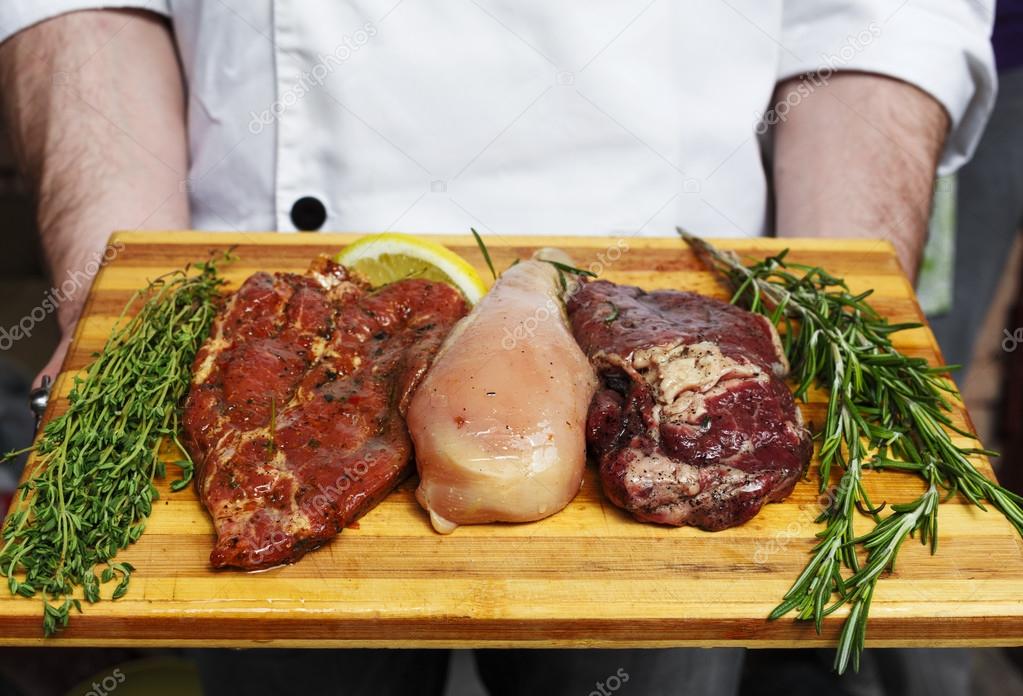 Fresh pork, beef and chicken meat on a cutting board — Stock Photo ...