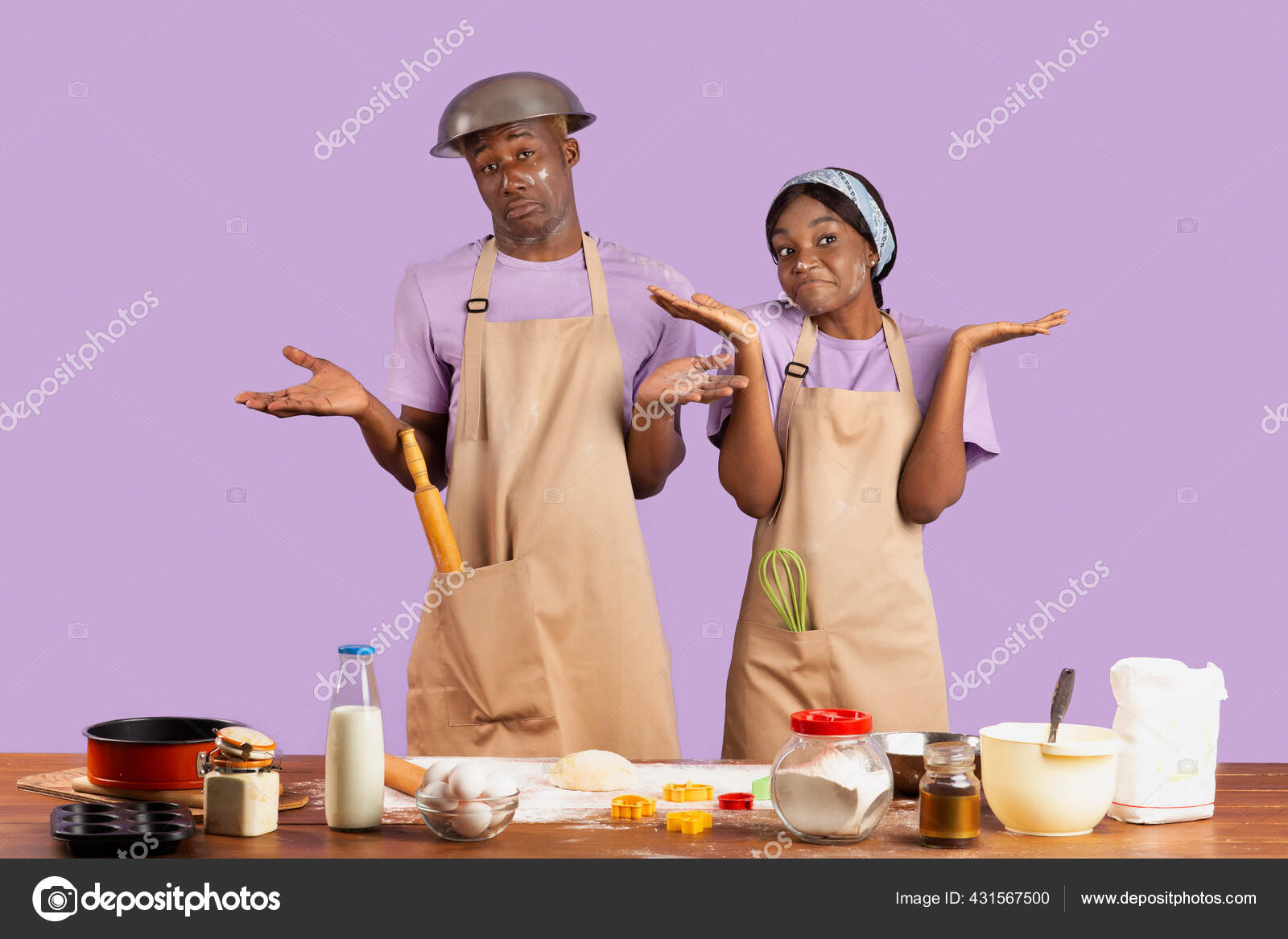 Confused black couple covered in flour shrugging, dont know how to cook ...