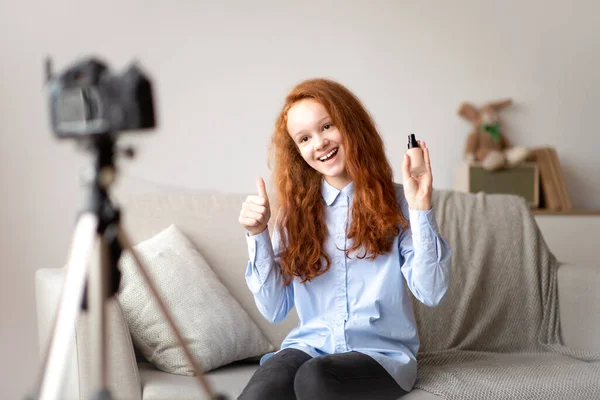 Red-Haired Teen Girl Recording Her Blog, Showing Thumbs Up Stock Photo ...