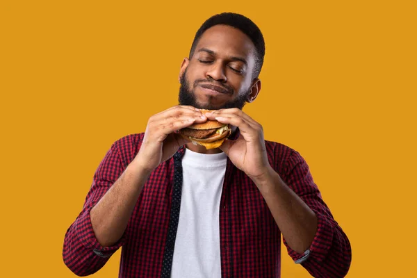 Hungry African American Guy Looking Burger Table Yellow Studio ...