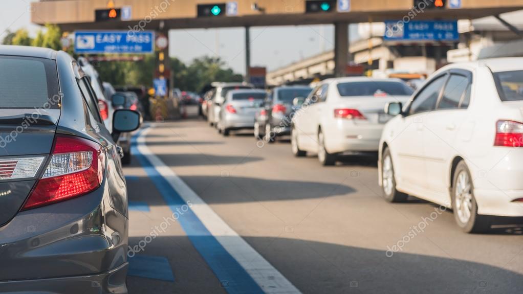 Car queue in front of express way gate Stock Photo by ...