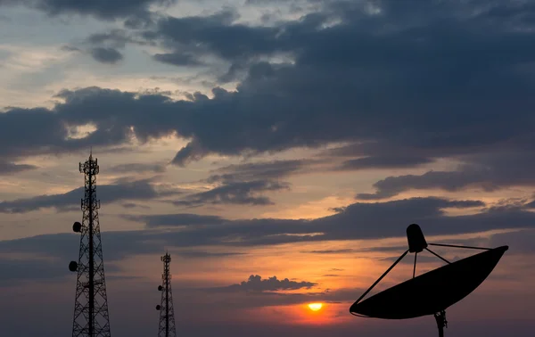 Satellite shadow and phone antenna sky background — Stock Photo ...