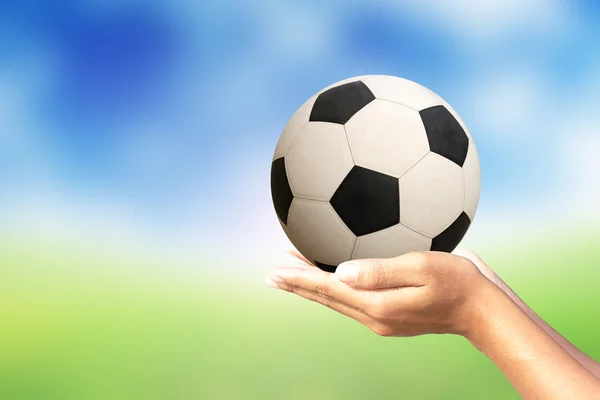 Soccer ball in hand Stock Photo by ©kibsri 12363902