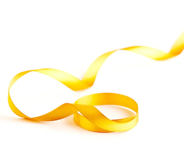 Curved gold silk ribbon — Stock Photo © ouh_desire #63051679