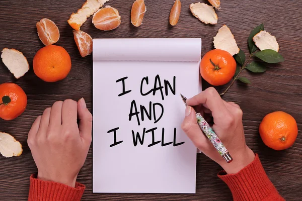 Motivation words I can and I will, inspiration quote. Woman writing ...