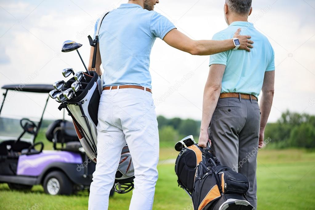 Two partners of game standing on golf course — Stock Photo ...
