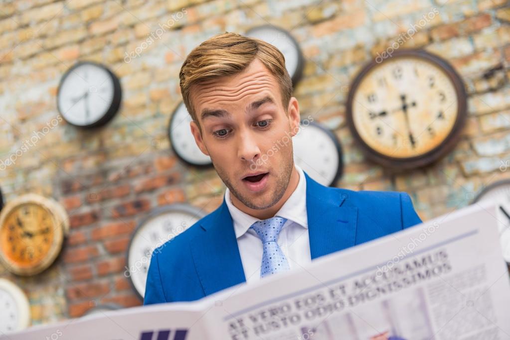 Businessman reading newspaper — Stock Photo © iakovenko123 #123128570 Businessman reading newspaper — Stock Photo © iakovenko123 #123128570