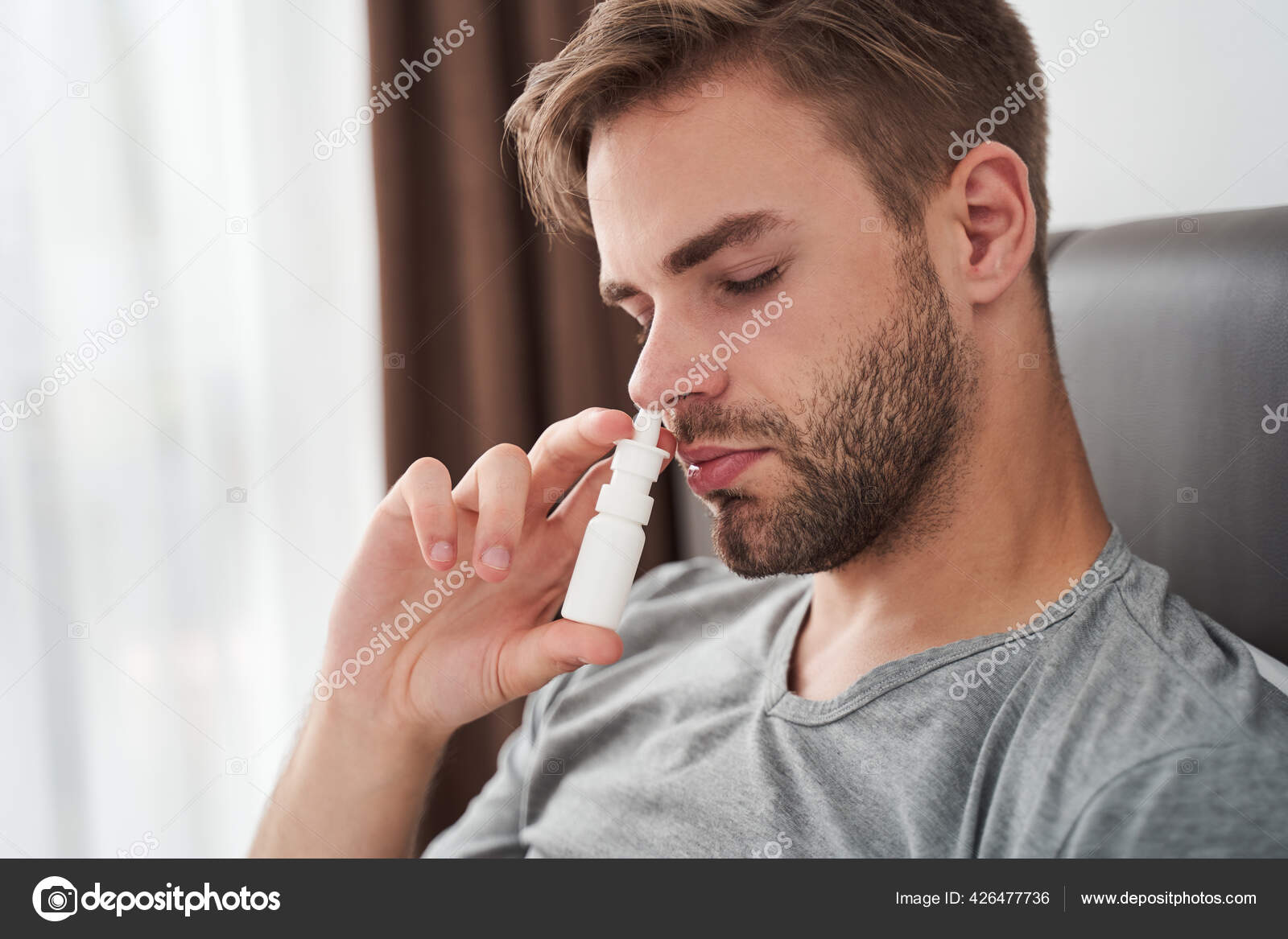Guy with a nasal spray — Stock Photo © iakovenko123 #426477736