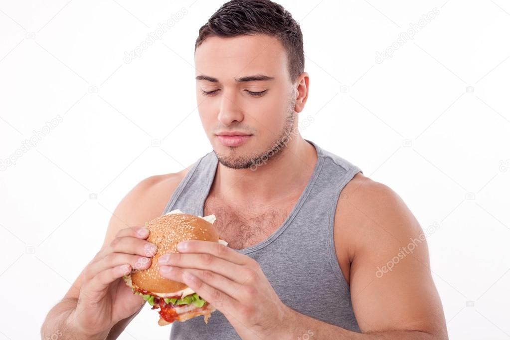 Attractive young guy is refusing to eat unhealthy food — Stock Photo ...