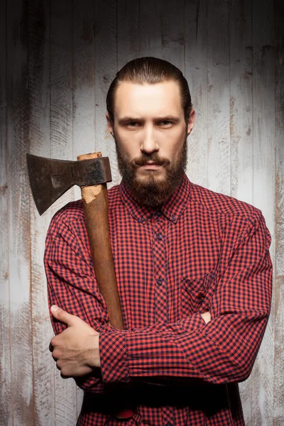Attractive fit lumberjack with beard and hatchet - Stock Image - Everypixel