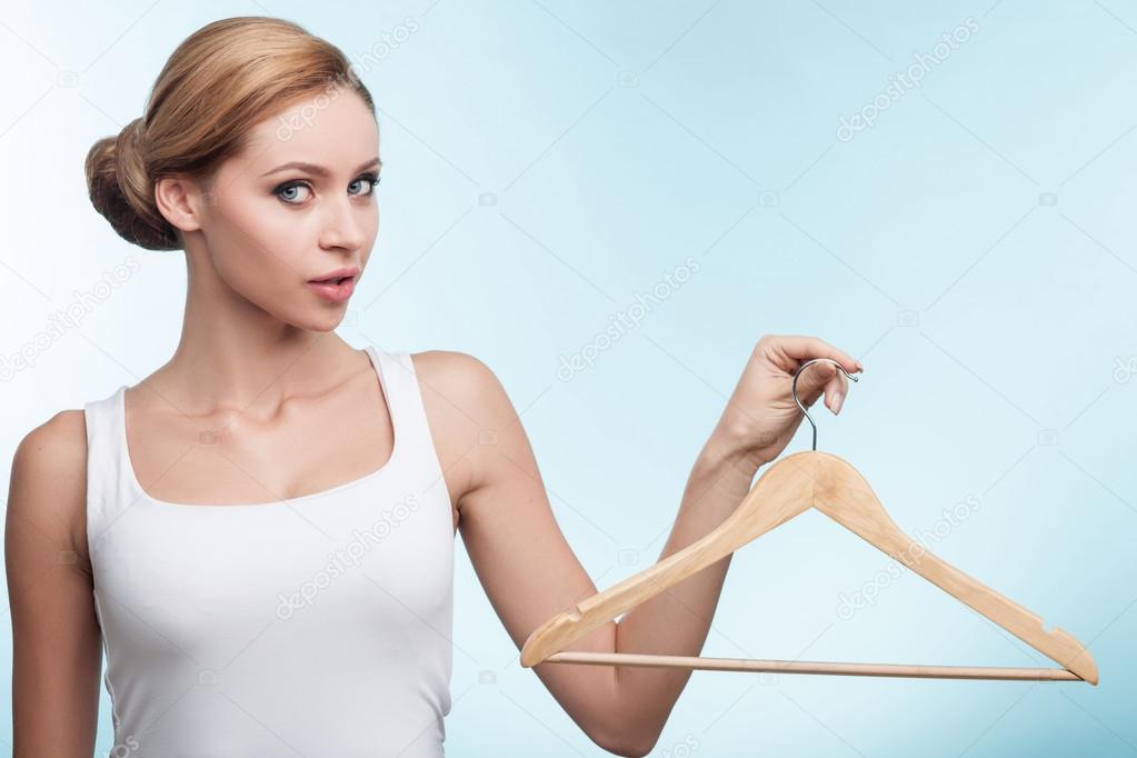 Cheerful young girl has nothing to wear Stock Photo by ©iakovenko123 ...