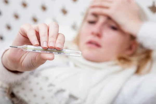 Cute ill girl has caught a cold — Stock Photo © iakovenko123 #90753876