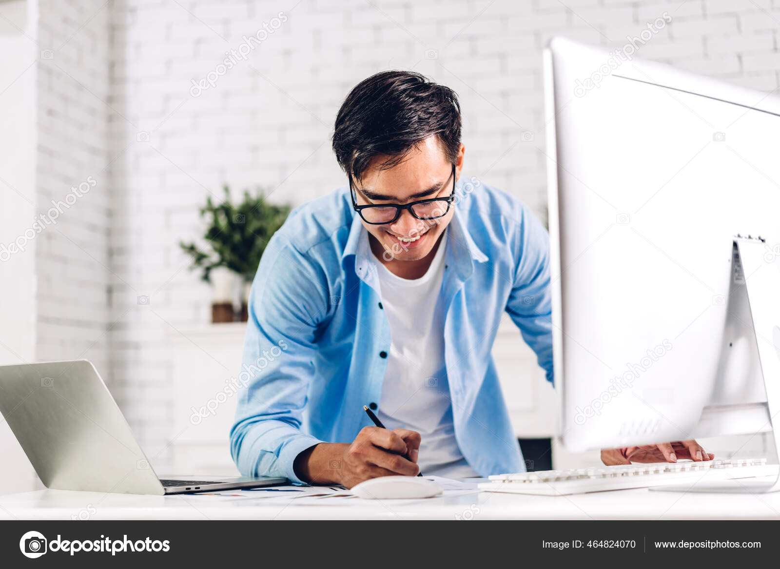 Young Smiling Asian Man Using Laptop Computer Working Video Conference ...