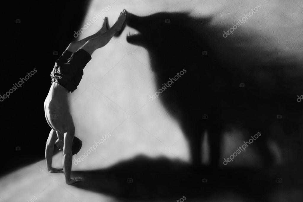 Handstand with wolf silhouette Stock Photo by ©PatrikV 72452705
