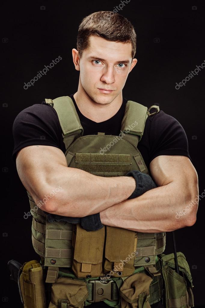 Soldier or private military contractor with his arms crossed . w ⬇ ...
