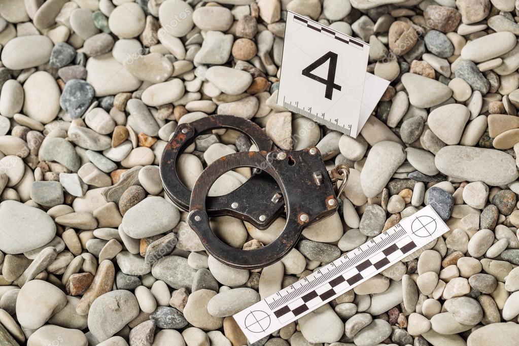 Crime scene investigation. Handcuffs dragged along outdoors — Stock ...