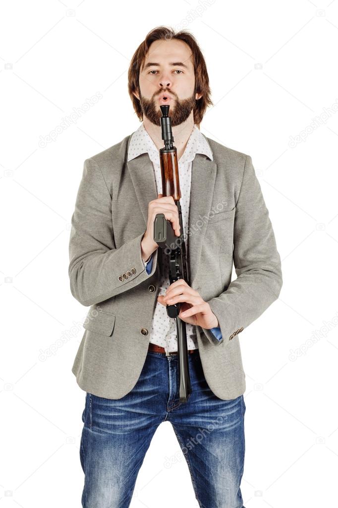 Man holding a machine gun Stock Photo by ©kaninstudio 110420882