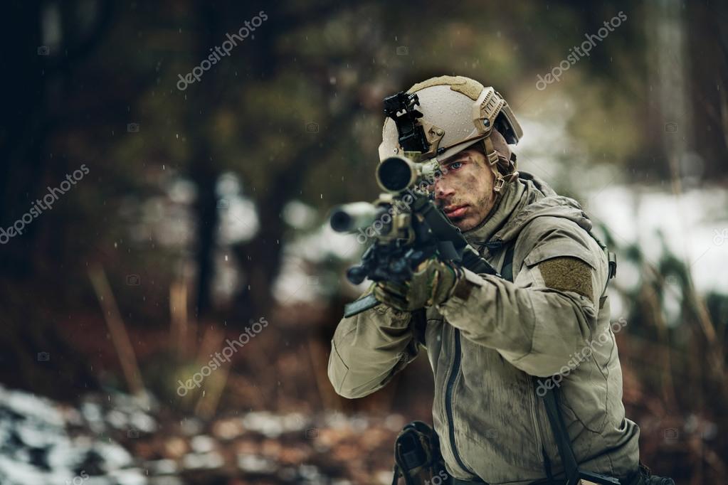 Armed man in camouflage with sniper gun — Stock Photo © kaninstudio ...