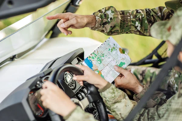 Young hunters determine the route map and navigator Stock Photo by ...