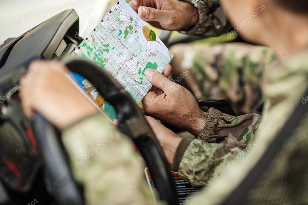 Young hunters determine the route map and navigator Stock Photo by ...