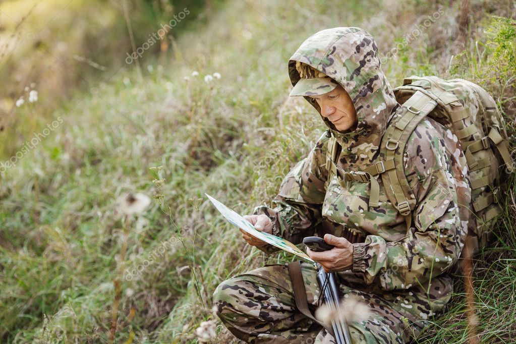 Hunter determine the route on the gps navigator — Stock Photo ...