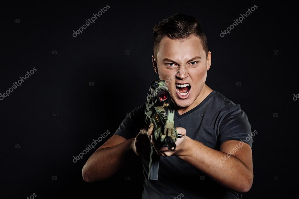 Militant with rifle on black background — Stock Photo © kaninstudio ...