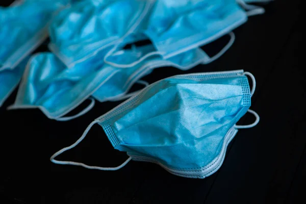 Used blue surgical protective masks. Pollution by surgical masks during ...