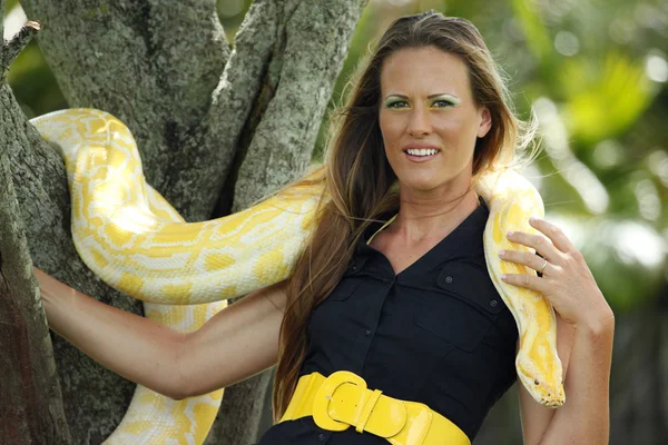 Woman plays with python Stock Photo by ©Redav 64592937