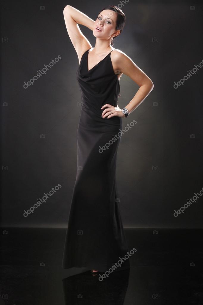 Elegant young woman in black dress — Stock Photo © Redav #64588565