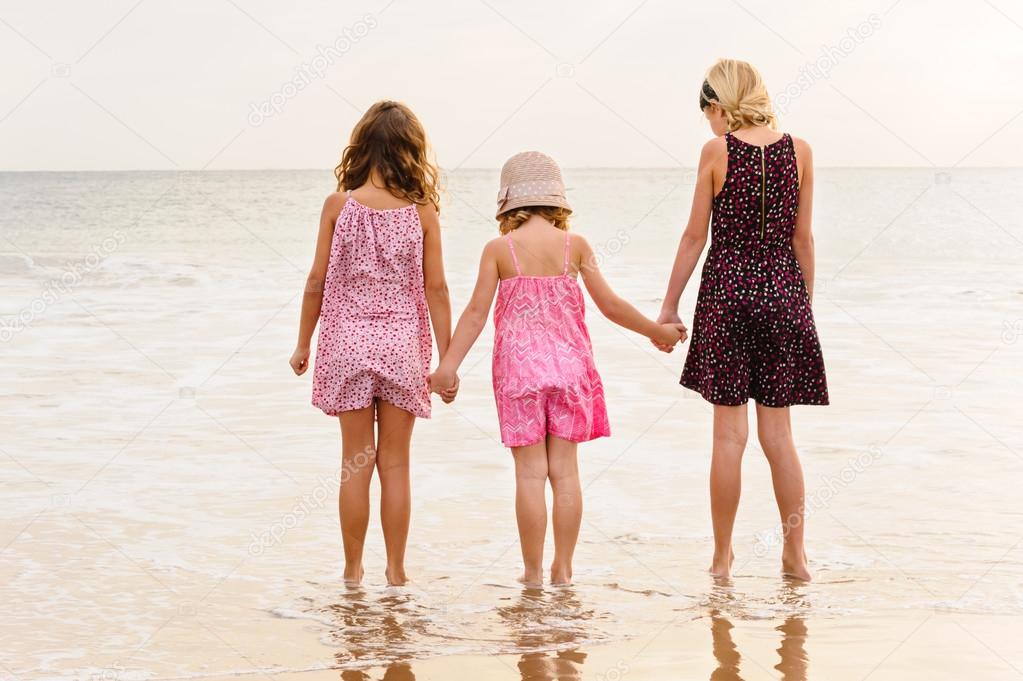 Three Sisters Holding Hands