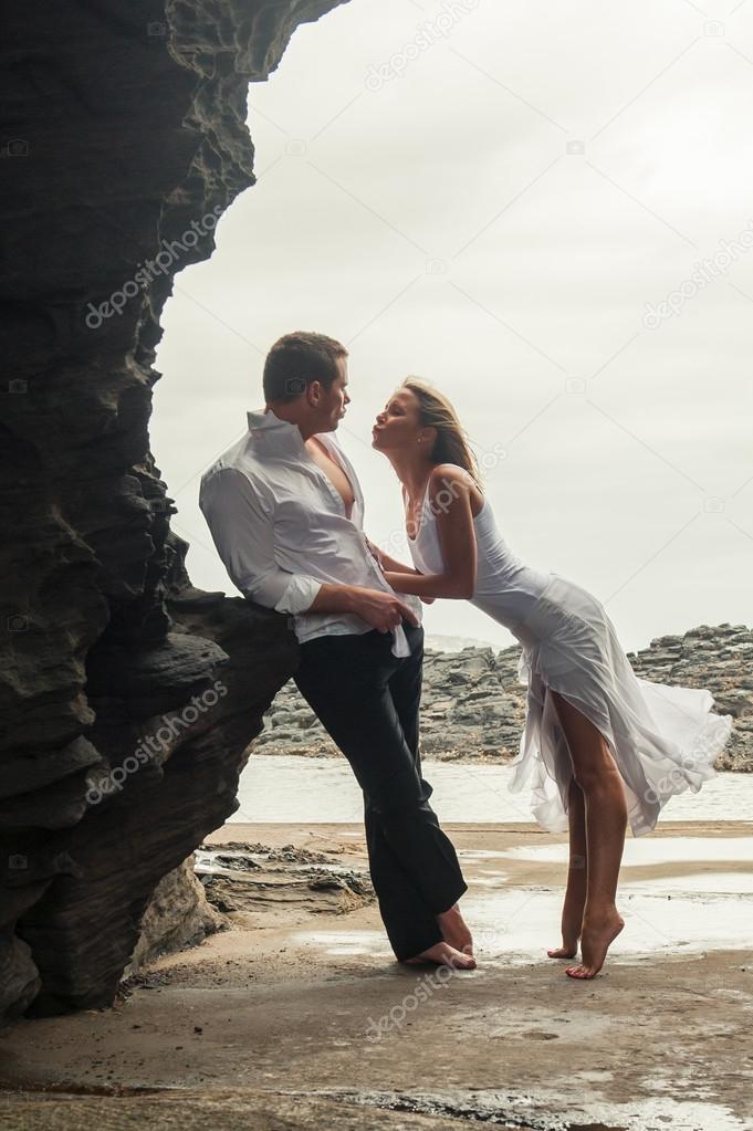 Beautiful couple in cave Stock Photo by ©geoffgoldswain 122010146